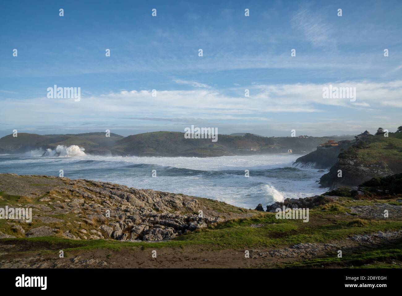 A view of huge waves crashing onto the shores of Cabo de Ajo on the ...