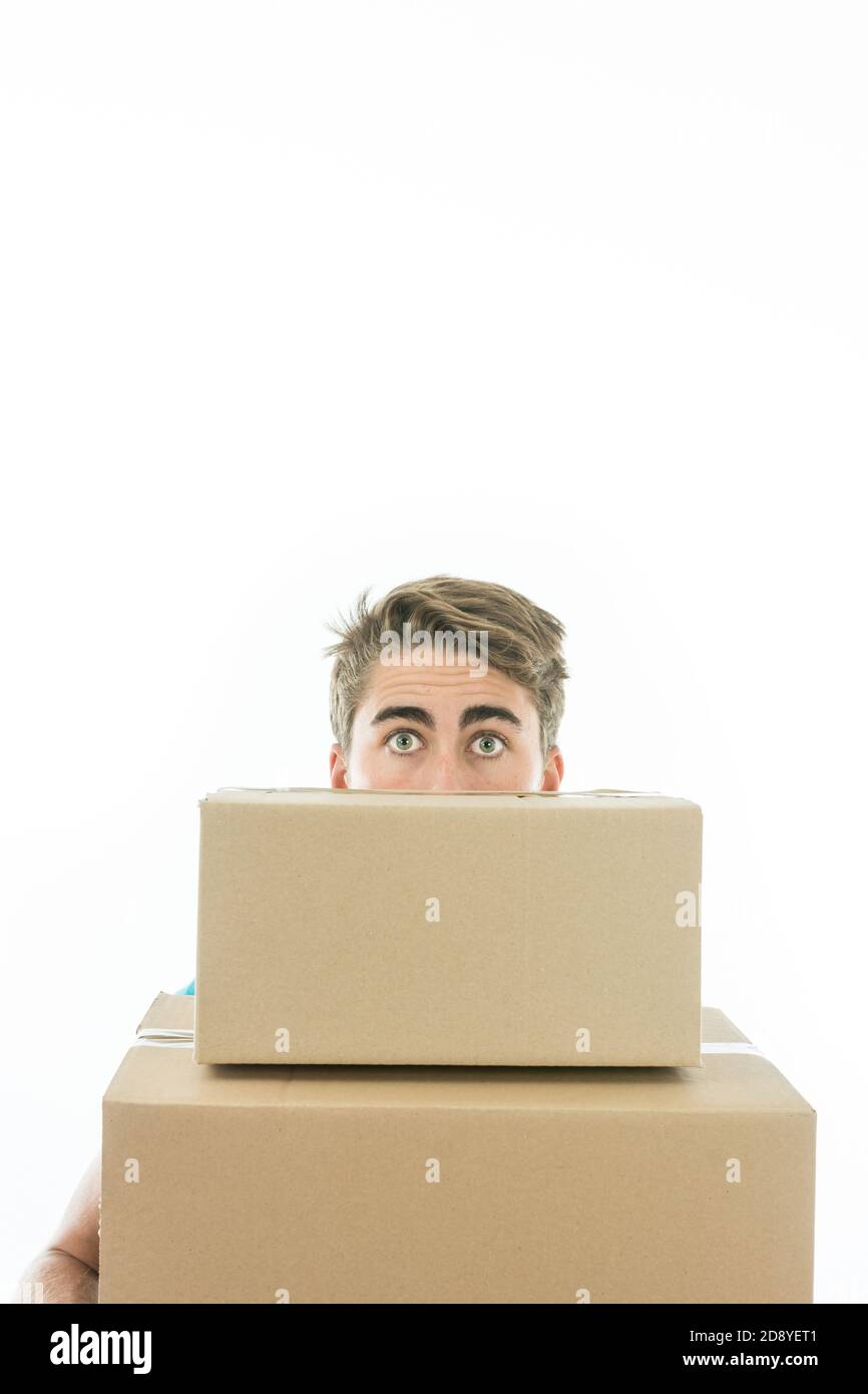 Boy carrying boxes of cardboard with things to send to transport ...