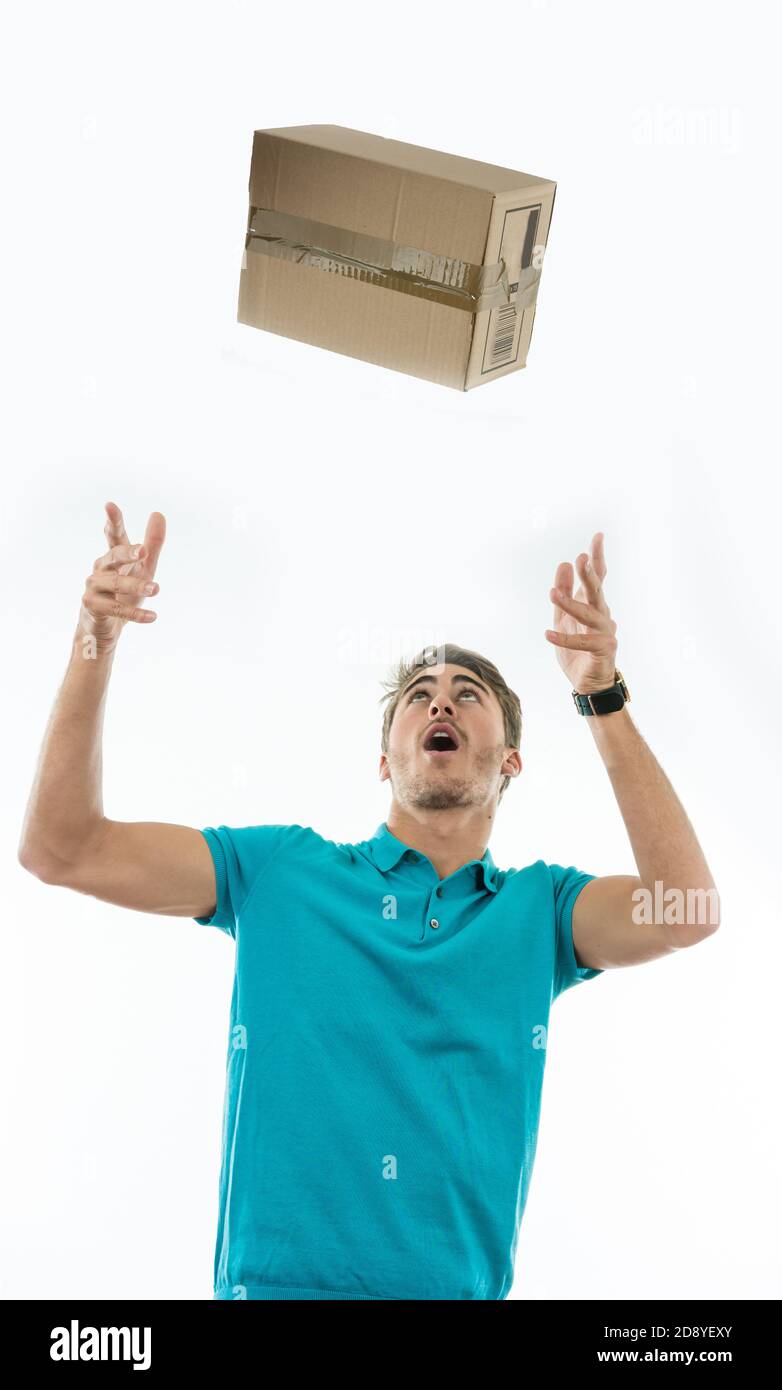 Boy carrying boxes of cardboard with things to send to transport ...