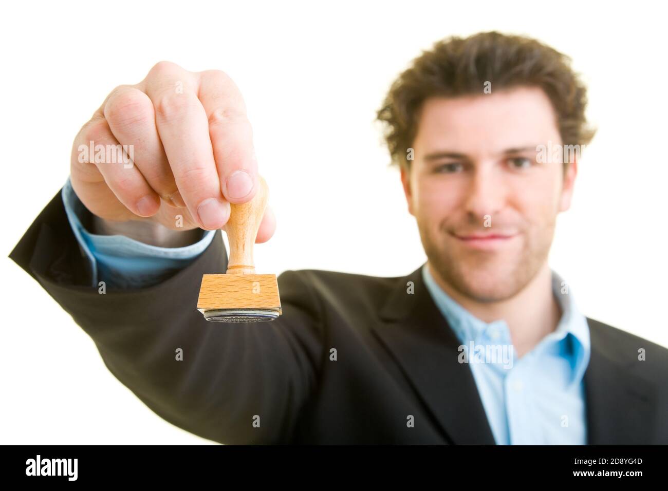 Young man in suit holds a stamp Stock Photo - Alamy
