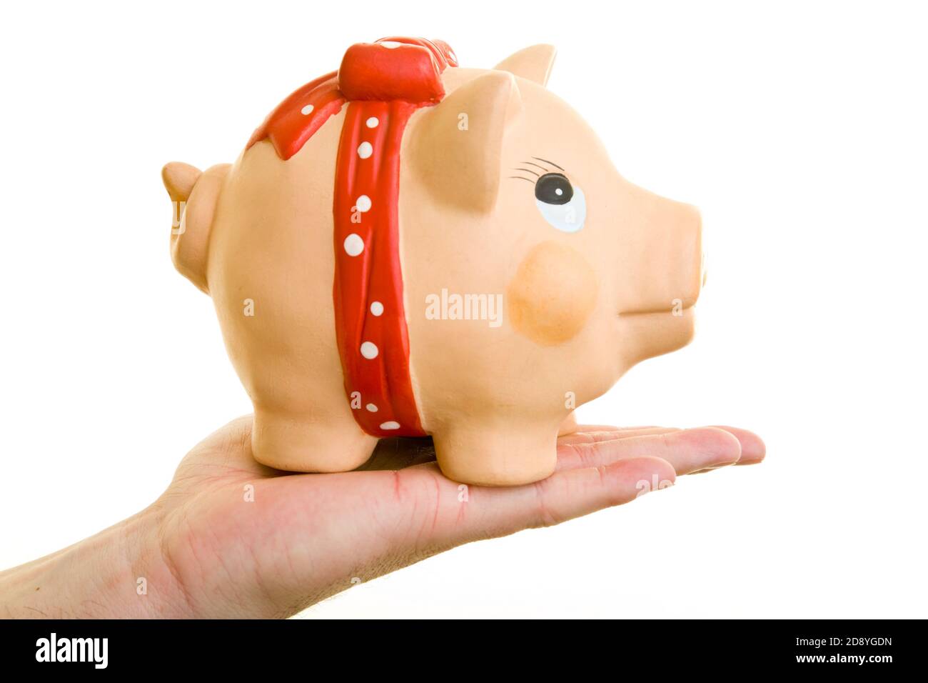 Hand with a piggy bank Stock Photo - Alamy