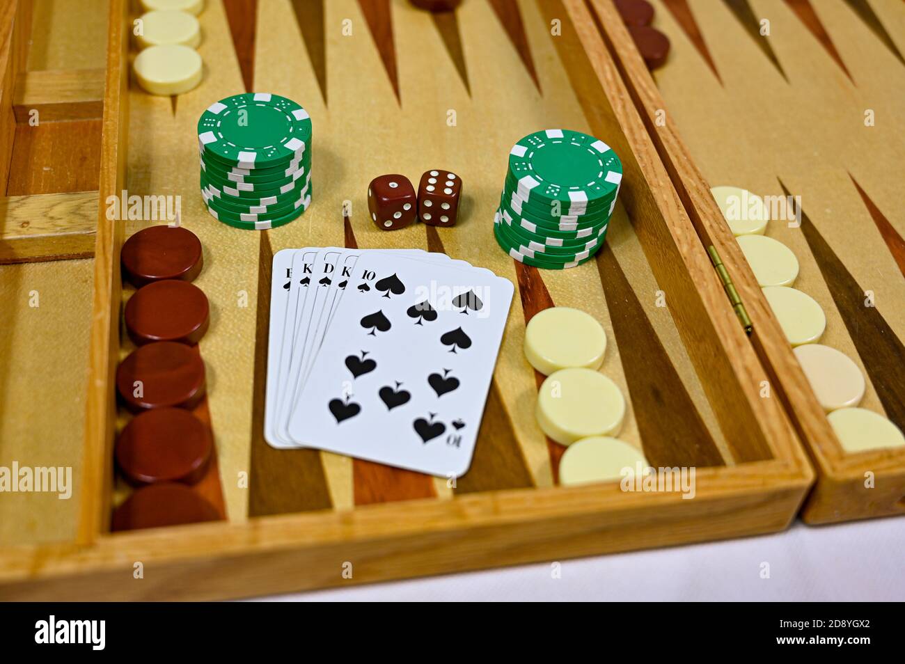 backgammon board with game pieces cards and dices Stock Photo - Alamy