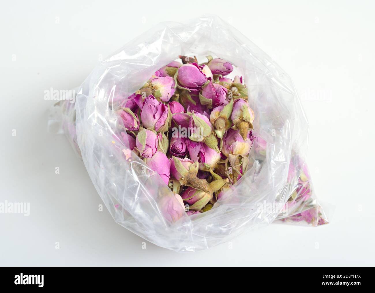 Dried rose buds isolated on white background Stock Photo - Alamy