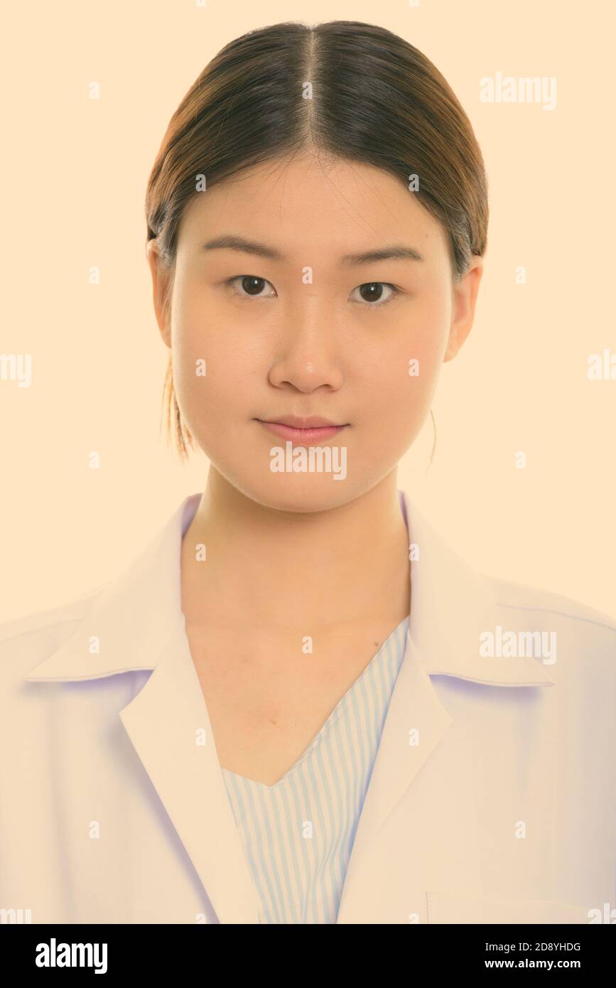 Face of young beautiful Asian woman doctor Stock Photo - Alamy