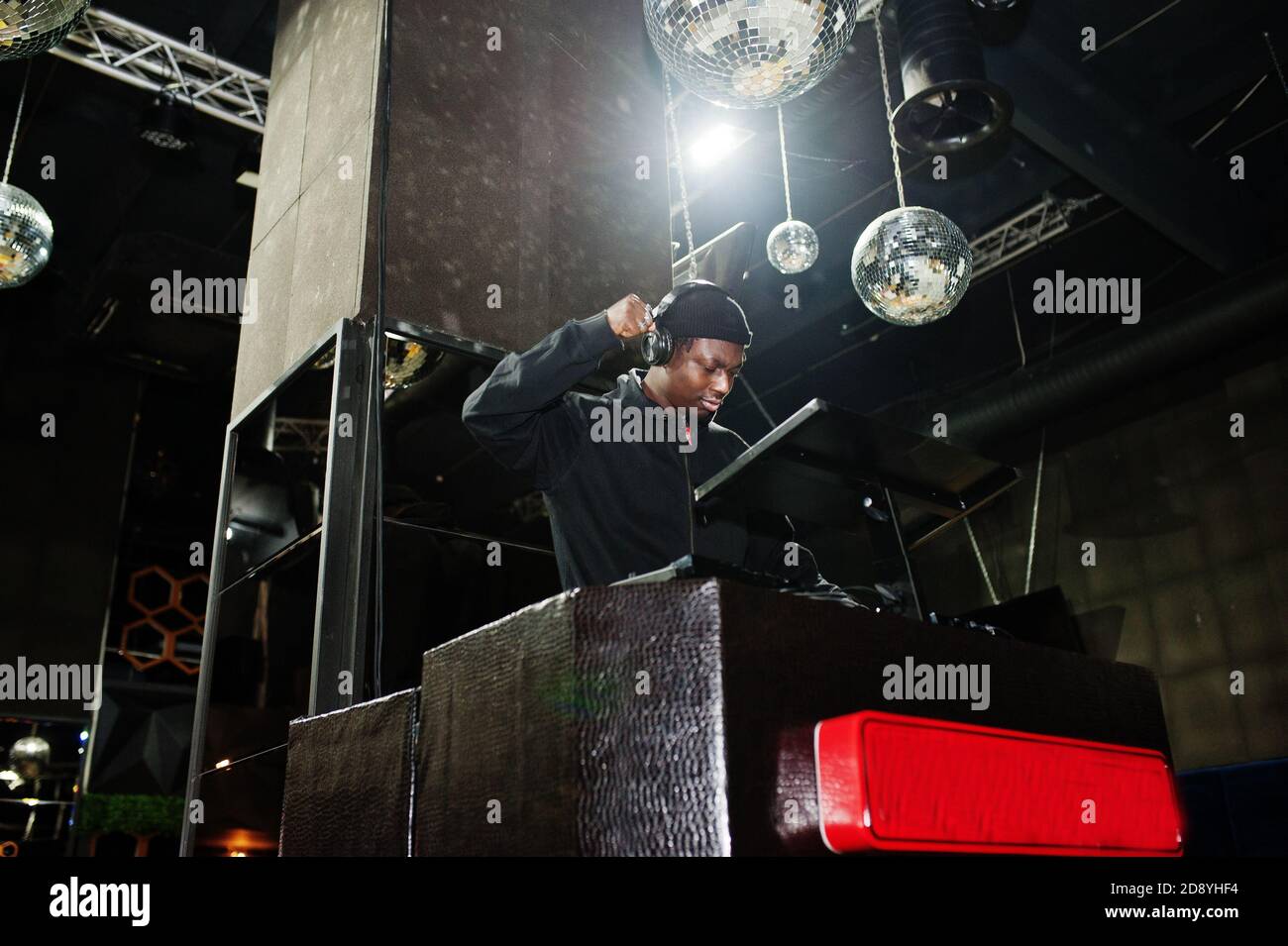 African american dj play music on decks at night club Stock Photo - Alamy