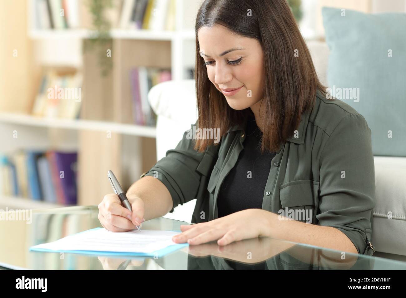 Signing contract sitting hi-res stock photography and images - Alamy
