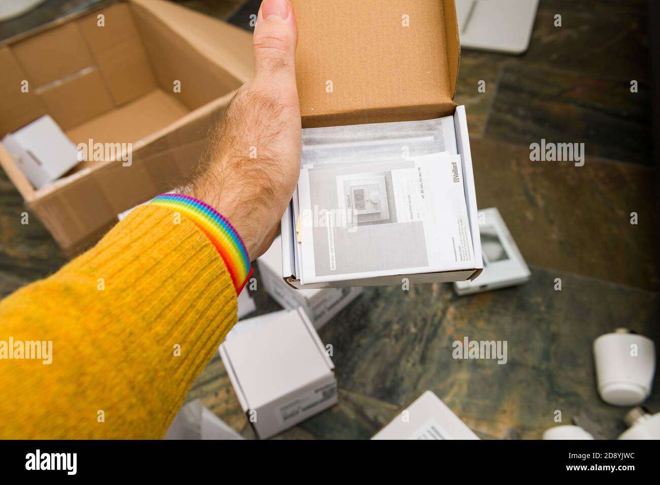 Paris, France - Oct 25, 2020: Man hand holding new Vaillant Ambisense ...