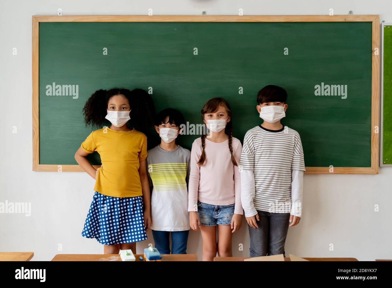 Group of diverse elementary students in classroom. Primary school multi ...