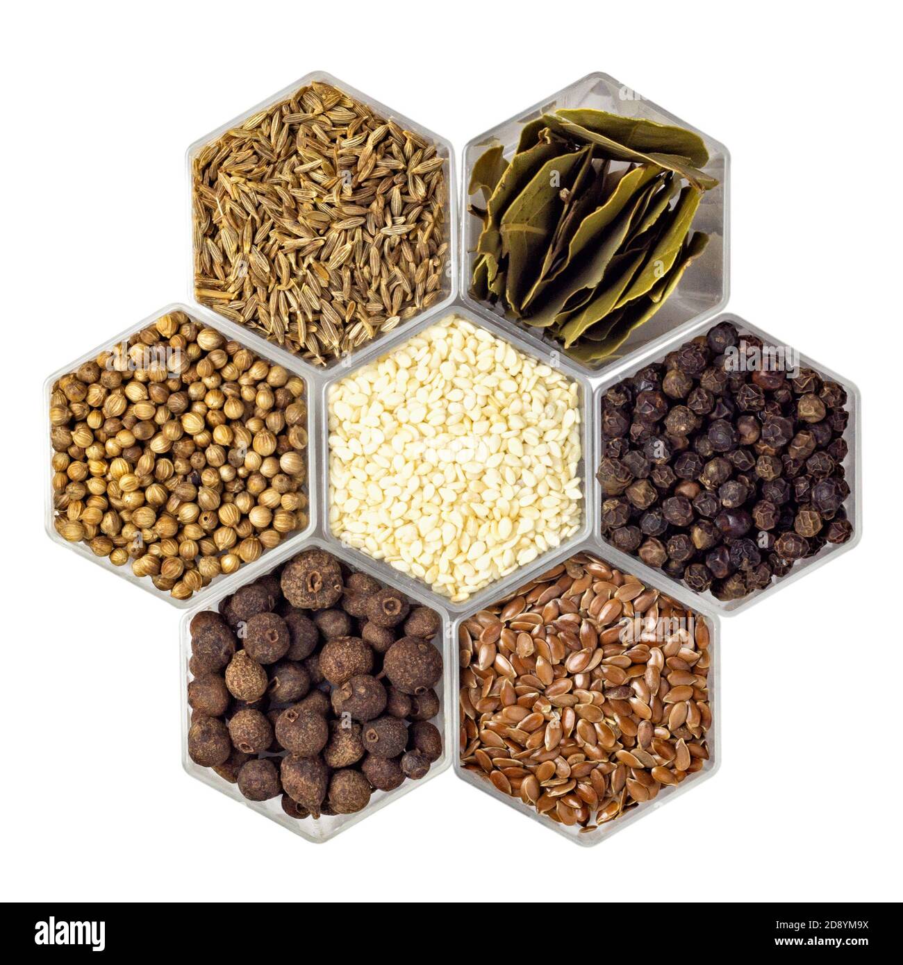 Various spices in hexagonal jars isolated on a white background Stock ...