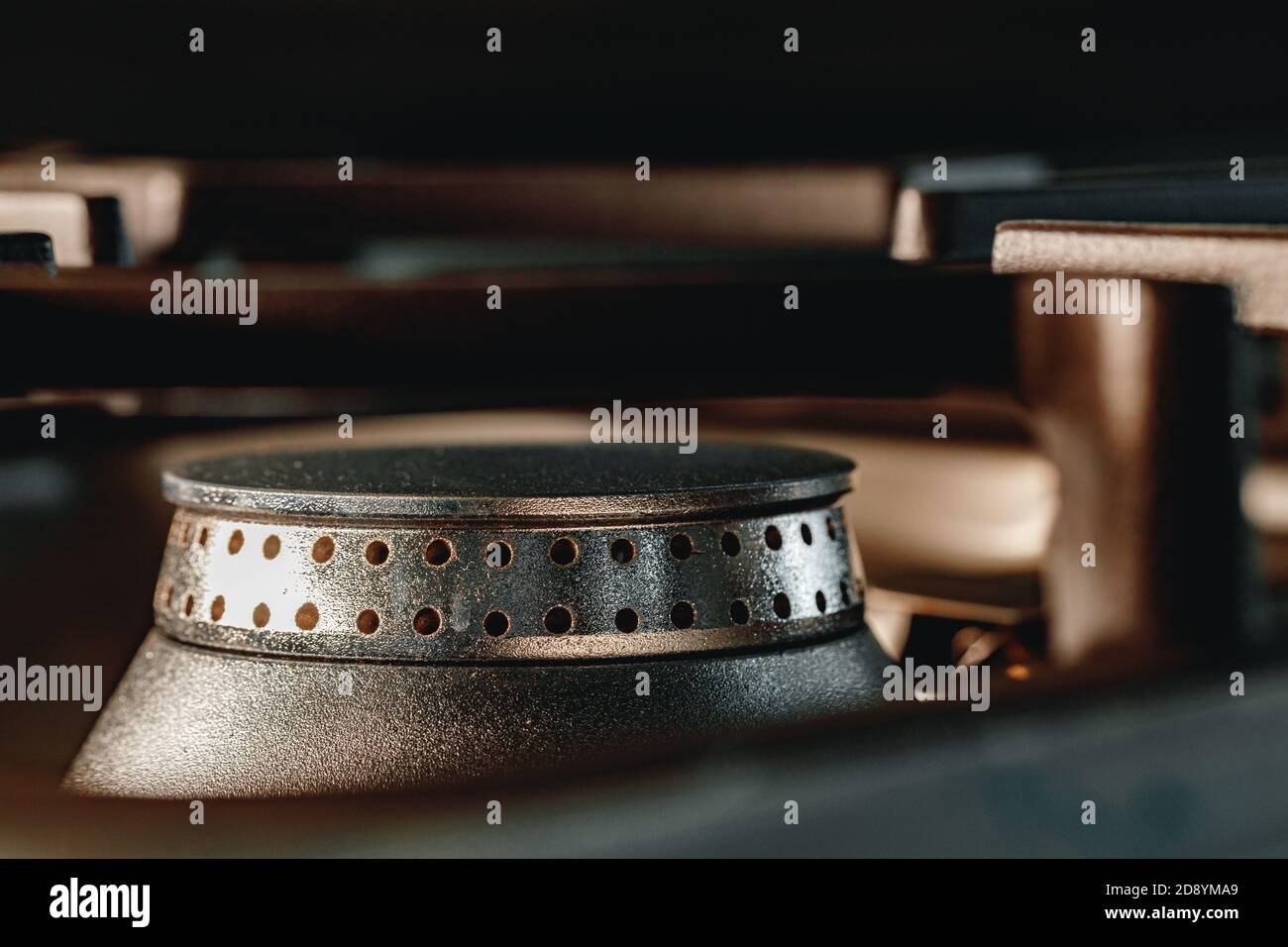 Unlit metal gas stove burner close up Stock Photo - Alamy
