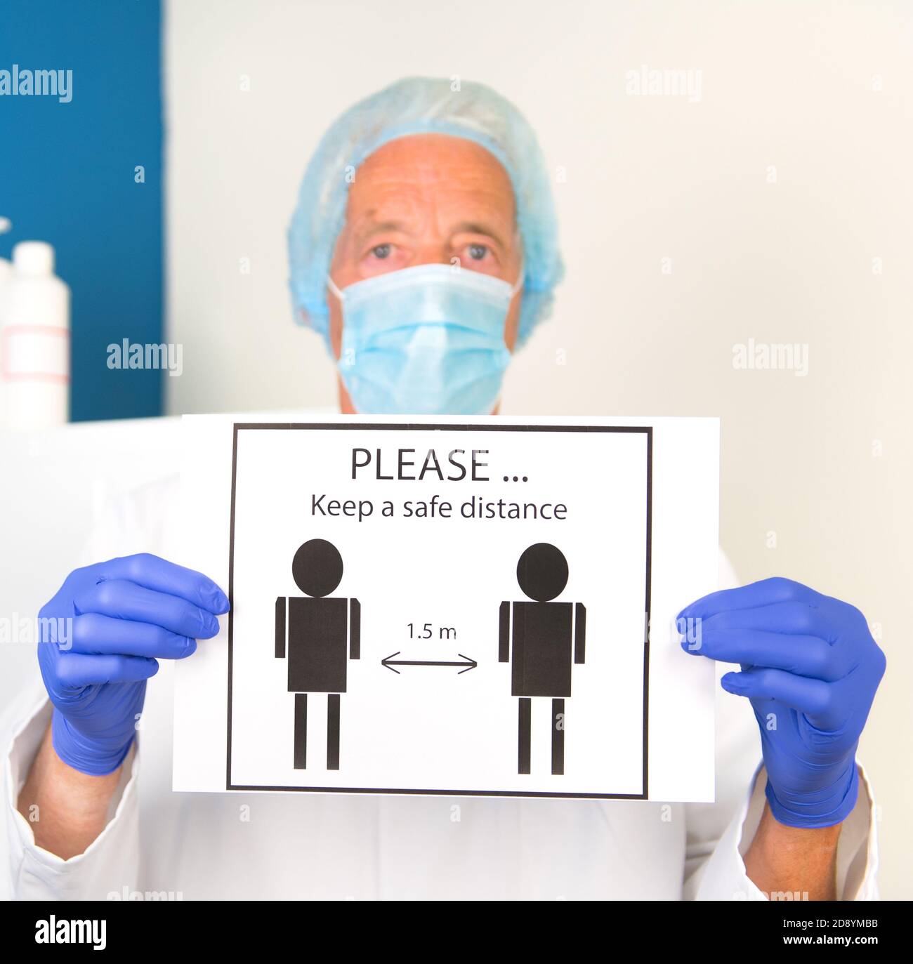 Doctor with face mask and protective clothing is asking for safe ...