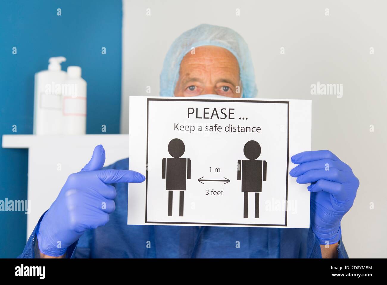 Doctor with face mask and protective clothing is asking for safe ...