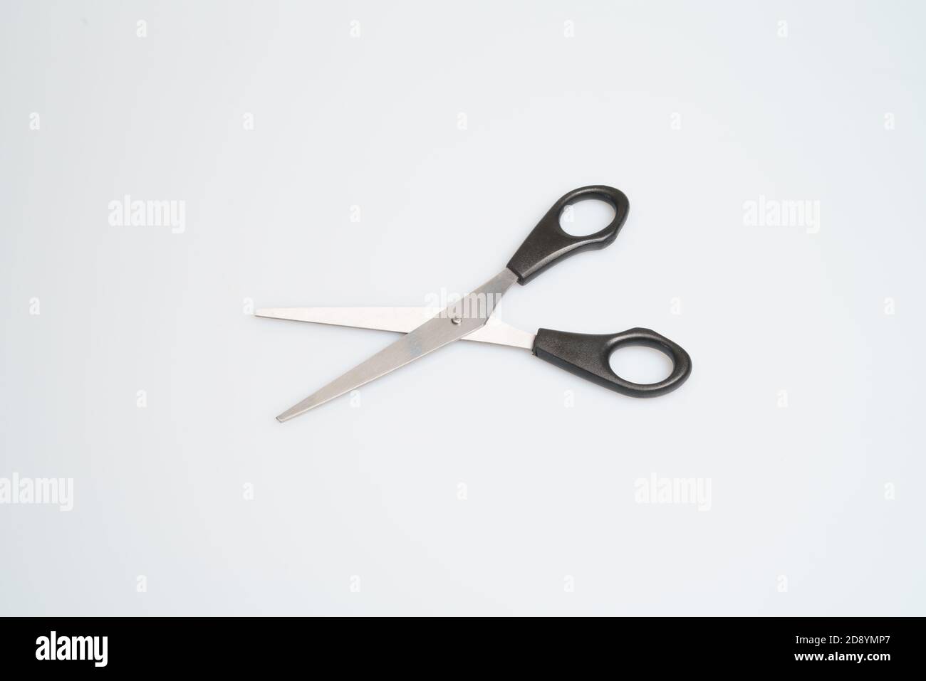 stainless steel scissors with black handle laid Stock Photo - Alamy