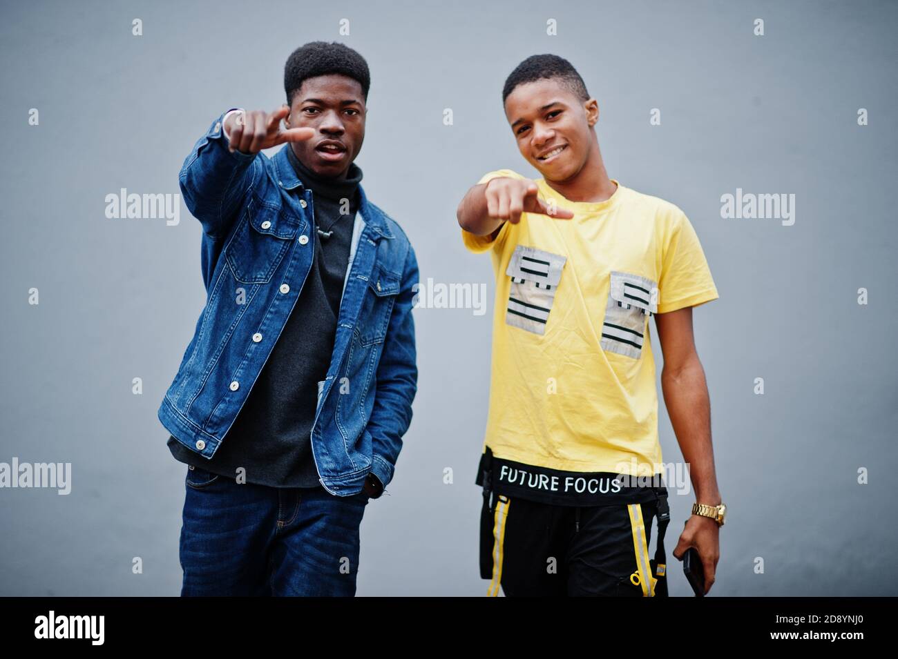 Two african male gangsta friends show fingers to the camera Stock Photo ...