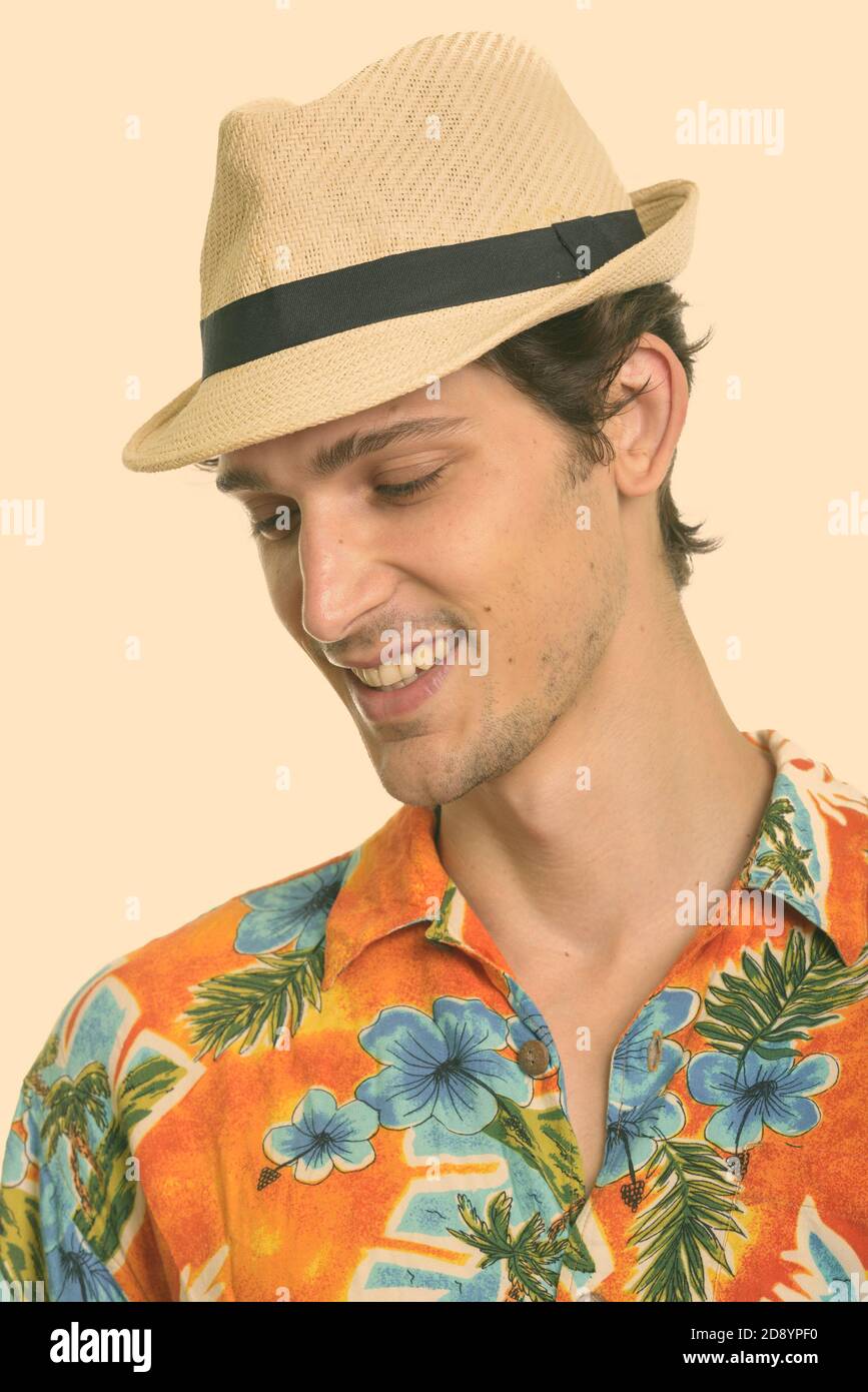 Face of young happy handsome man smiling while looking down Stock Photo ...