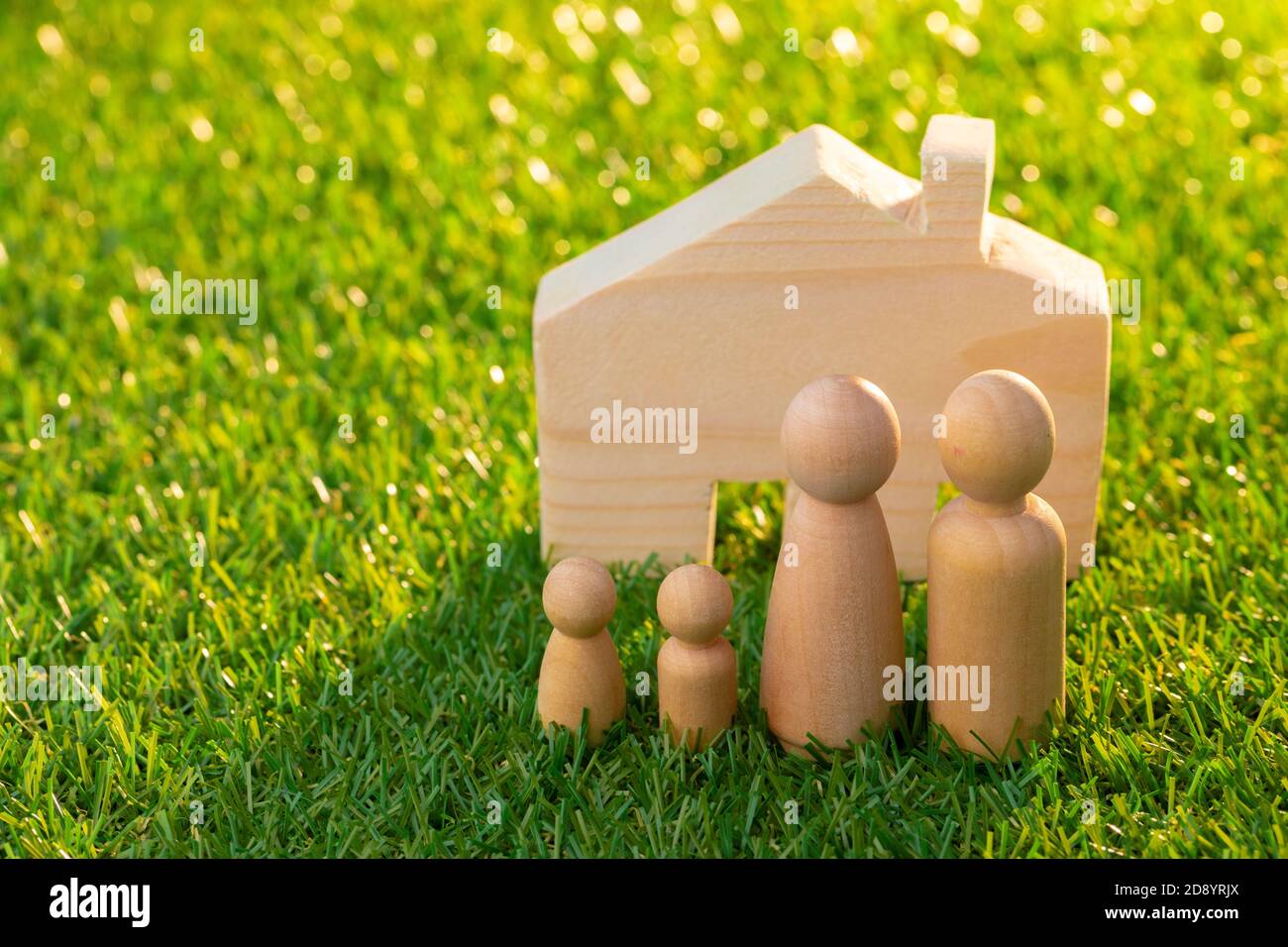 Wooden men figures and toy wooden house Stock Photo - Alamy