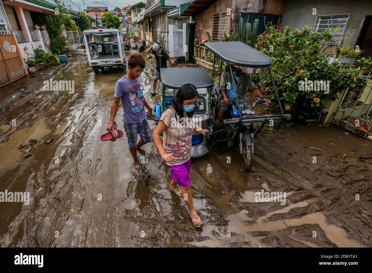 Batangas Province, Philippines. 2nd Nov, 2020. Residents walk on a road ...
