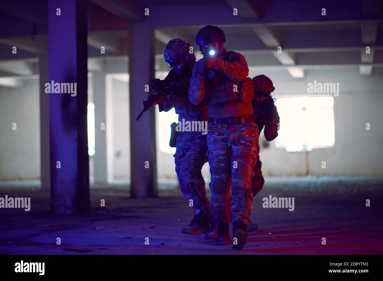 Soldiers squad in tactical formation having action urban environment ...