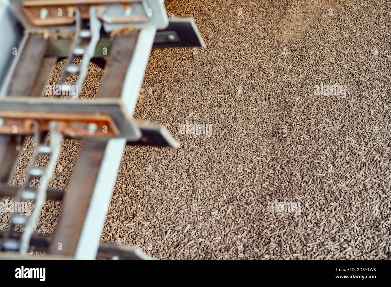 Large pile of compressed eco wood pellets Stock Photo - Alamy