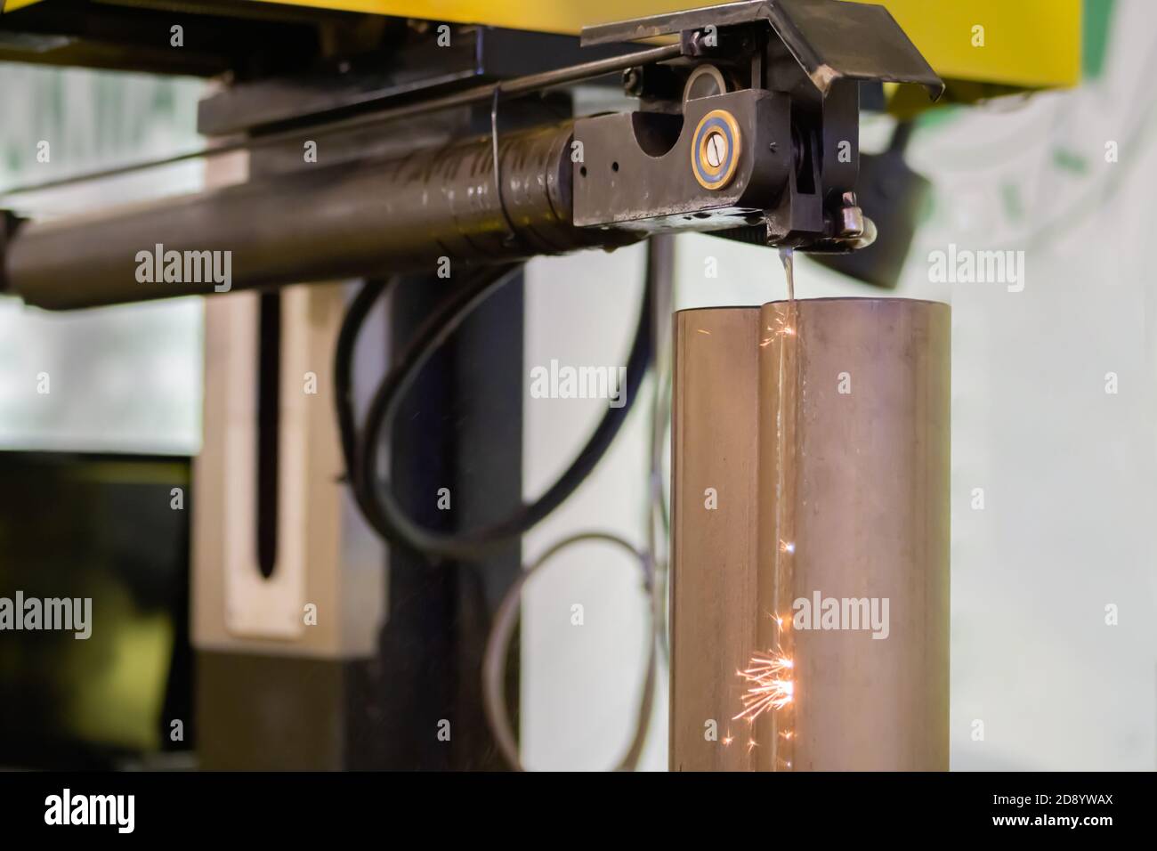 Wire cutting machine working with metal workpiece with sparks at ...