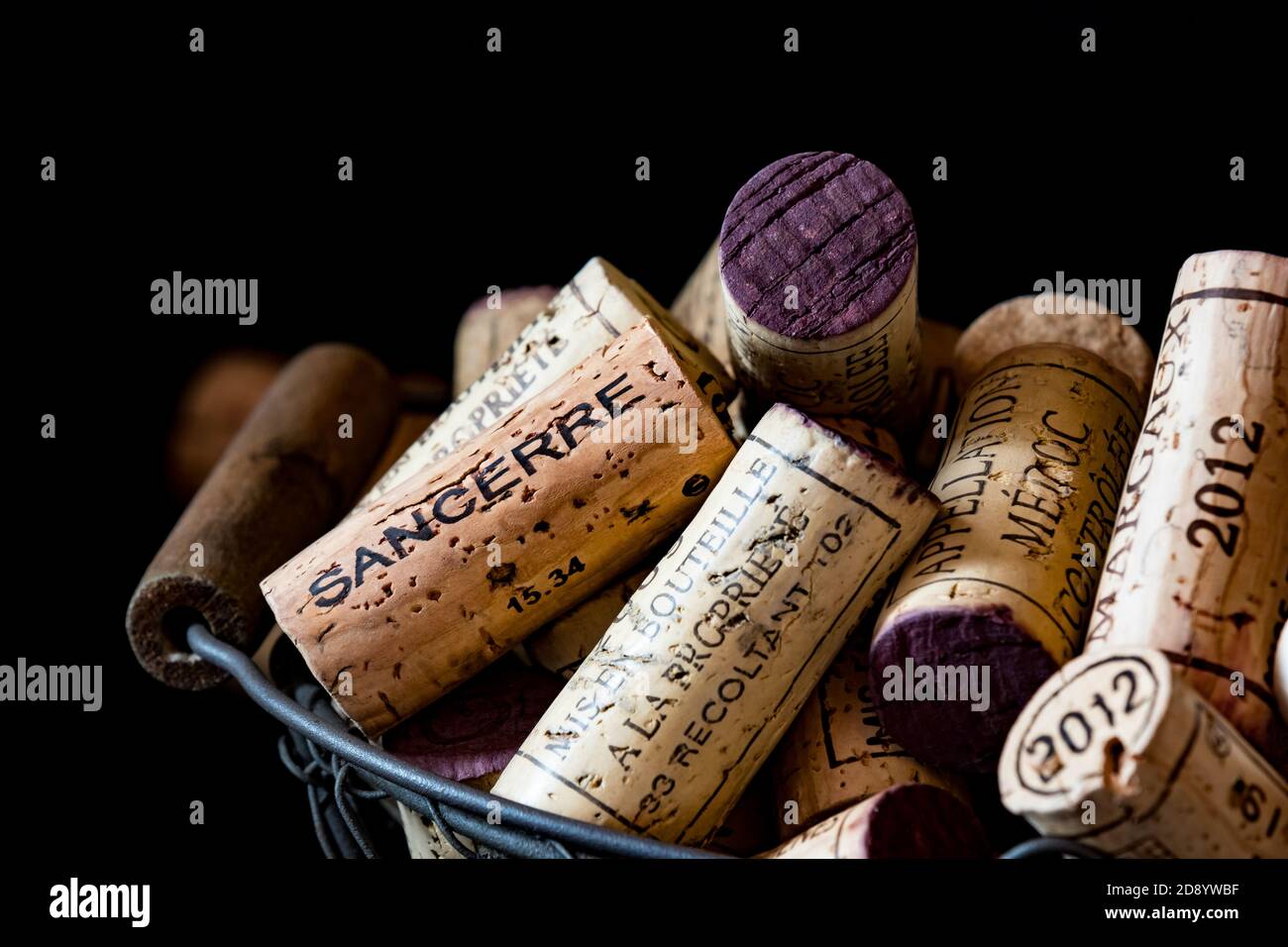 old cork stoppers of French wines in a wire basket Stock Photo - Alamy