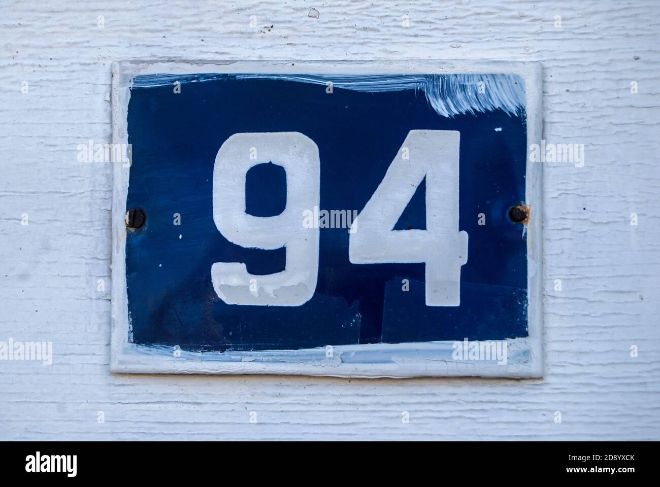 Weathered grunge square metal enameled plate of number of street ...
