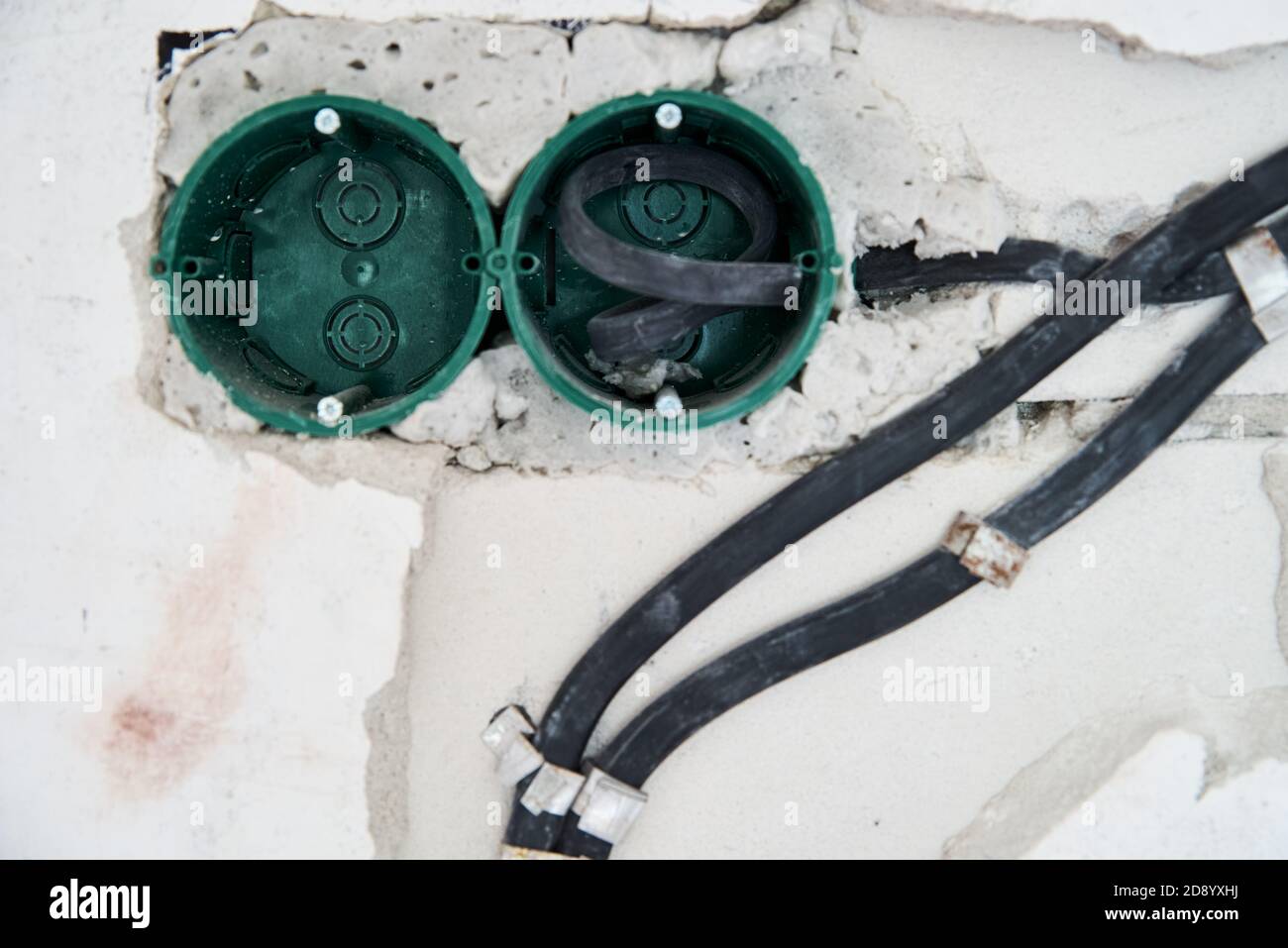 Socket for wiring in concrete wall. Renovation concept Stock Photo - Alamy