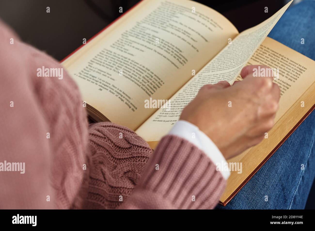 Woman sitting and reading book. Relaxing concept Stock Photo - Alamy