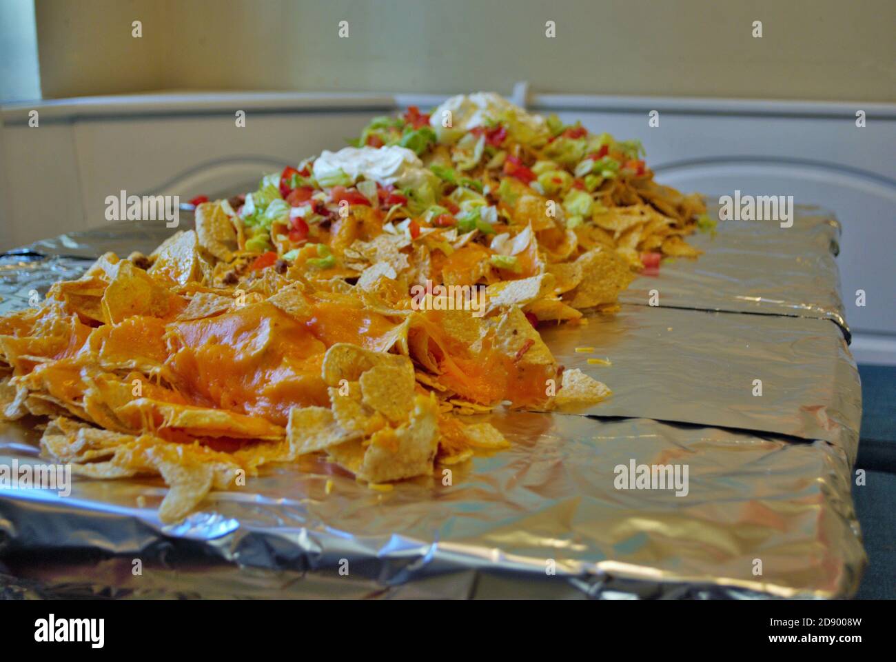 Nacho table kitchen table wrapped in aluminum foil and covered with ...