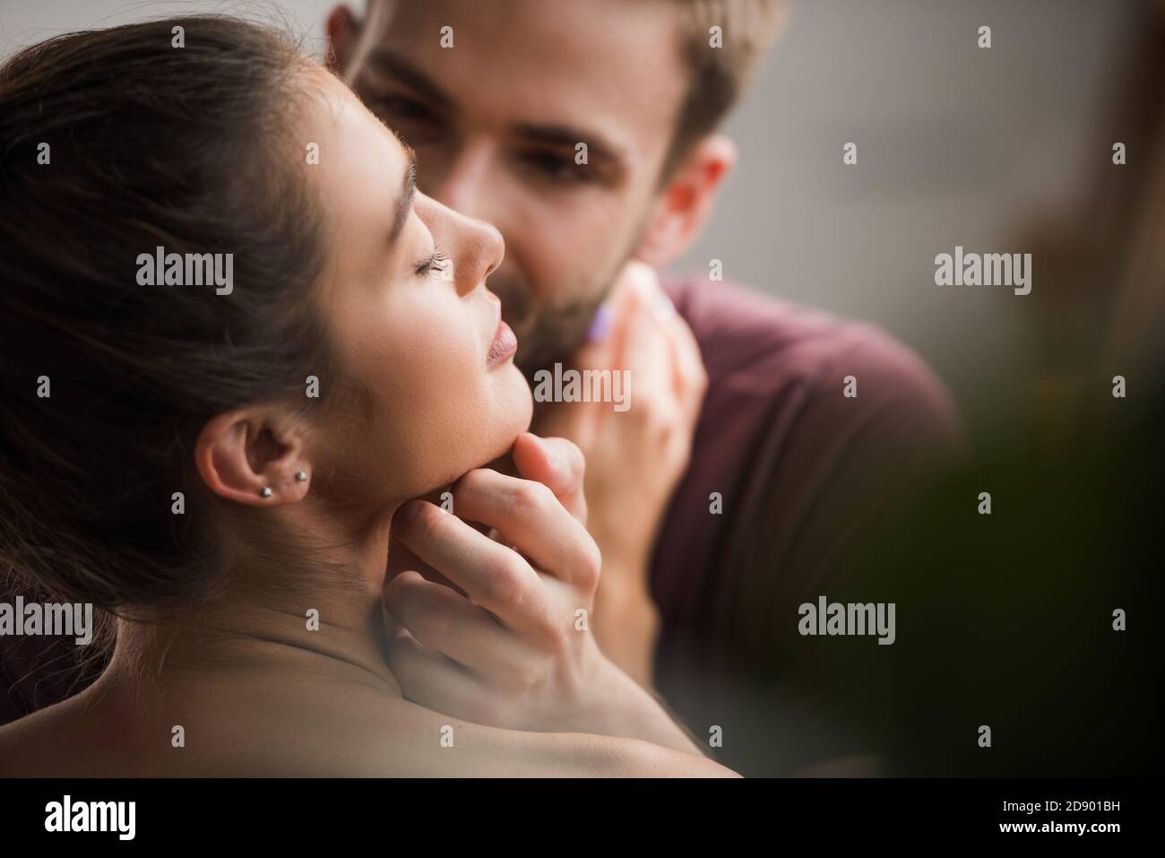 tender man touching face ow beloved girlfriend with closed eyes on ...