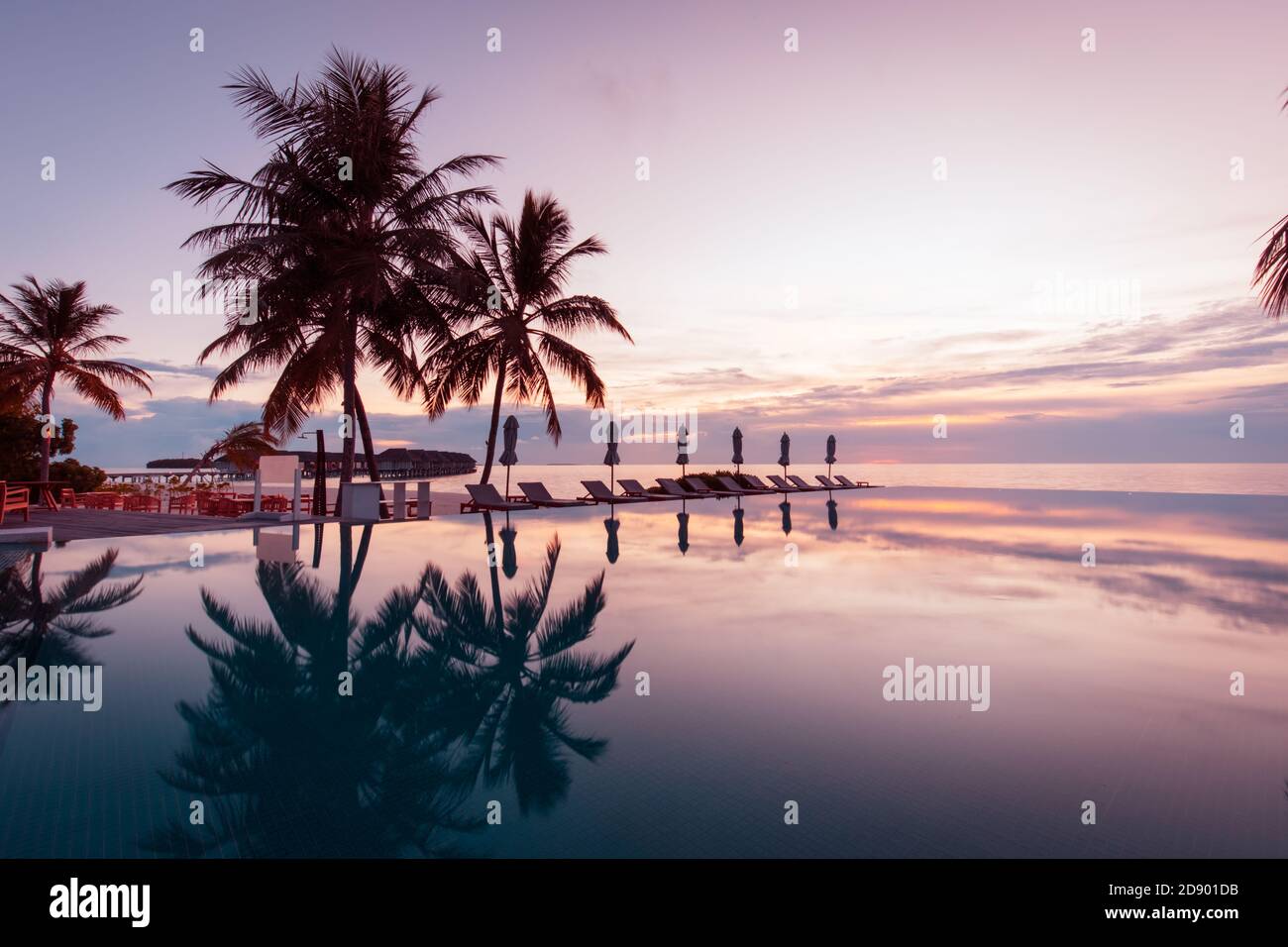 Beautiful poolside and sunset sky. Luxurious tropical beach landscape ...