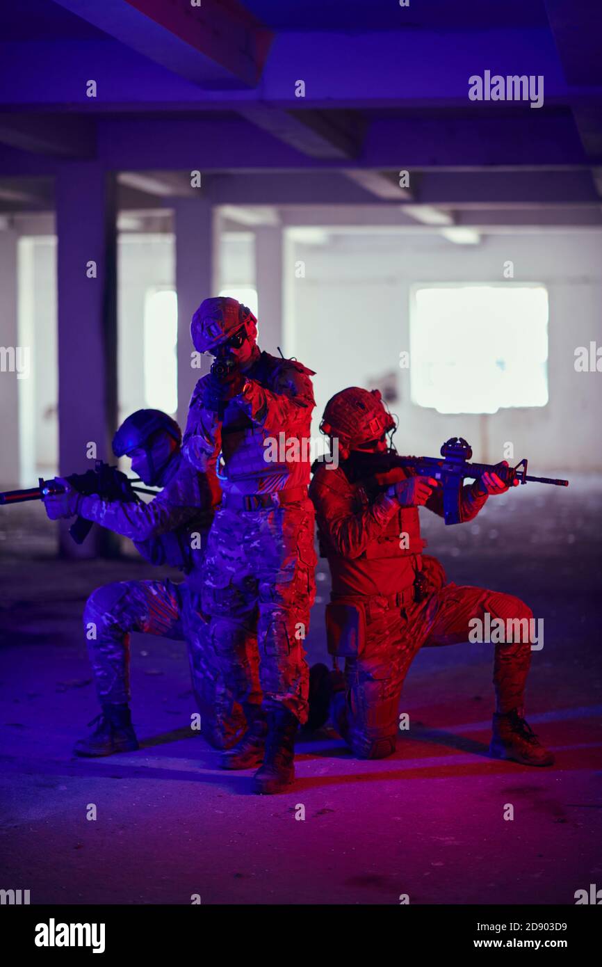 Soldiers squad in tactical formation having action urban environment ...