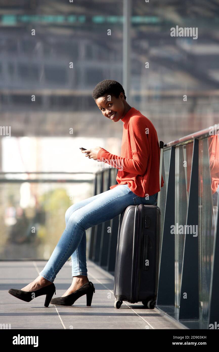 Full length side portrait of young african american travel woman ...
