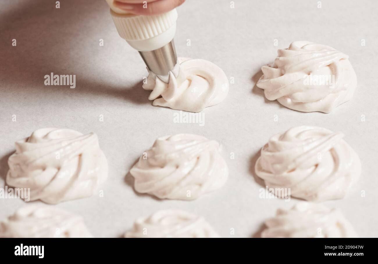 The process of making homemade meringue cookies for the holiday Stock ...