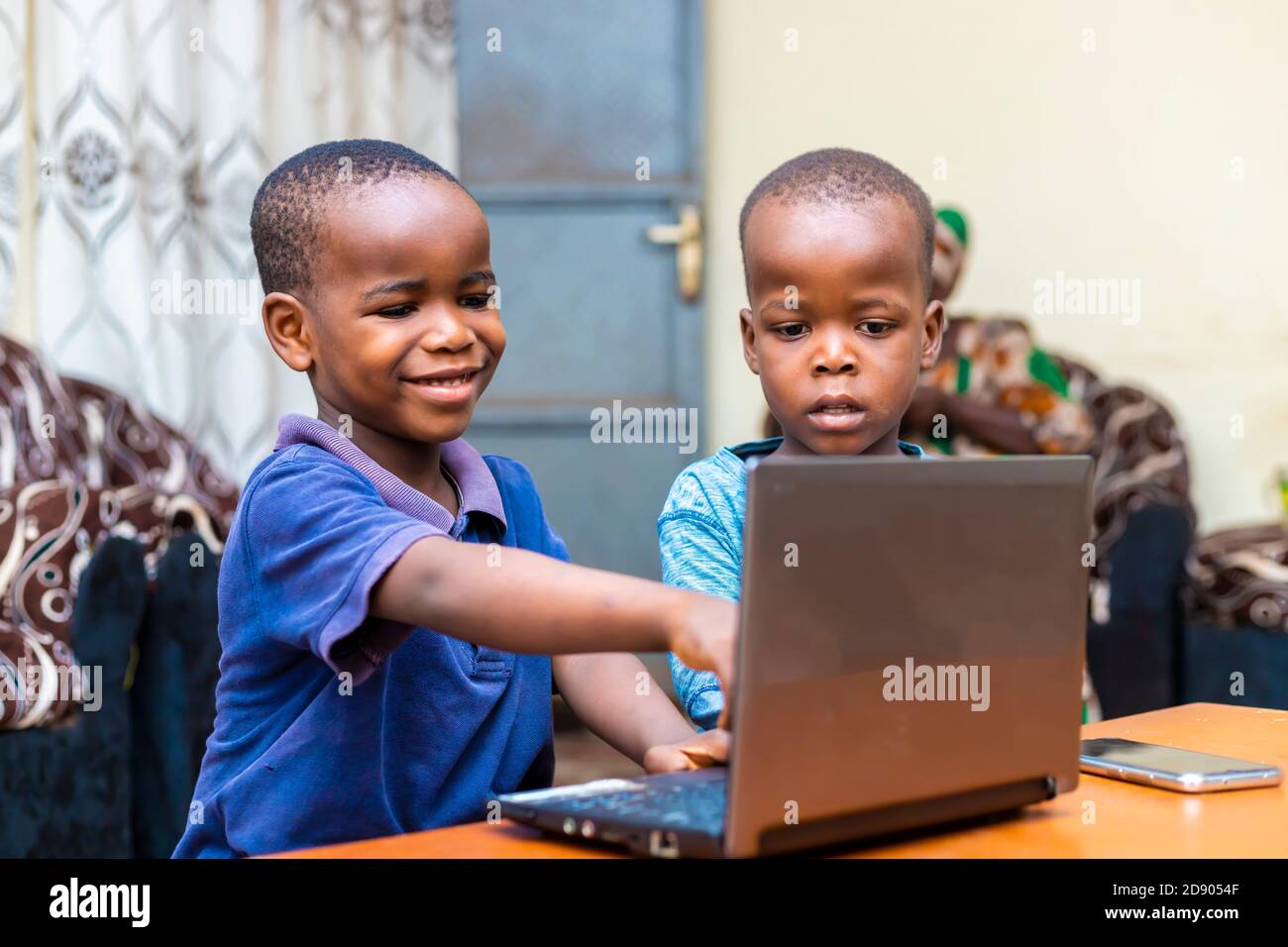 African teen boy laptop hi-res stock photography and images - Alamy
