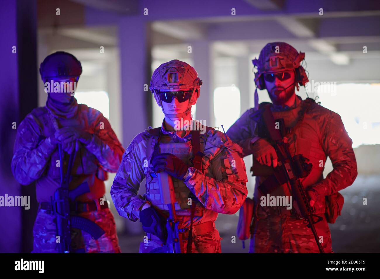 soldier squad team portrait in urban environment colored lightis Stock ...