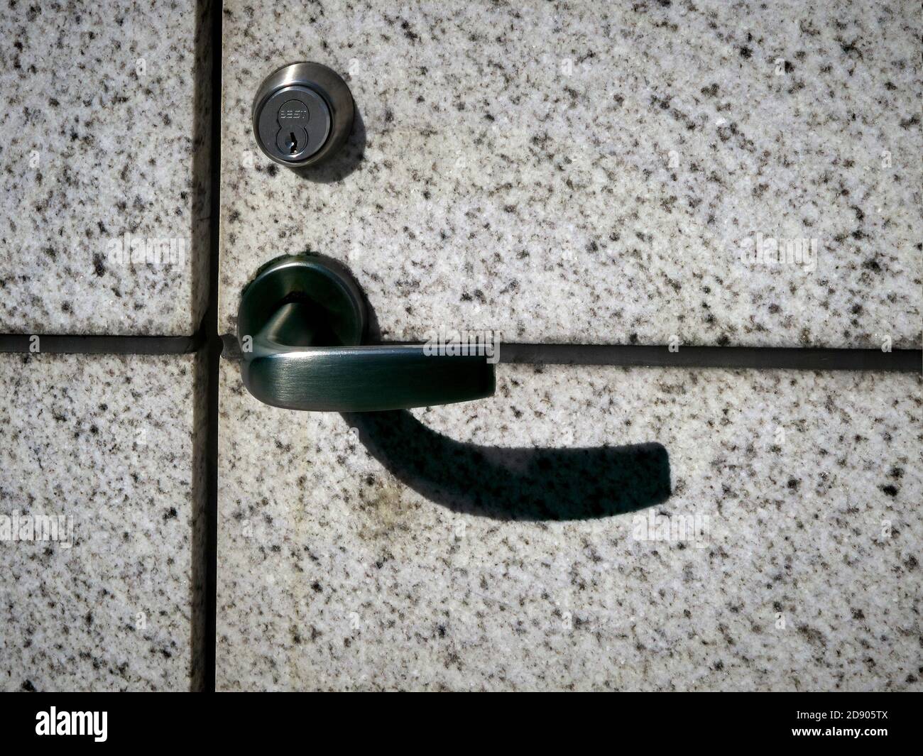Handle and lock embedded in a wall Stock Photo - Alamy