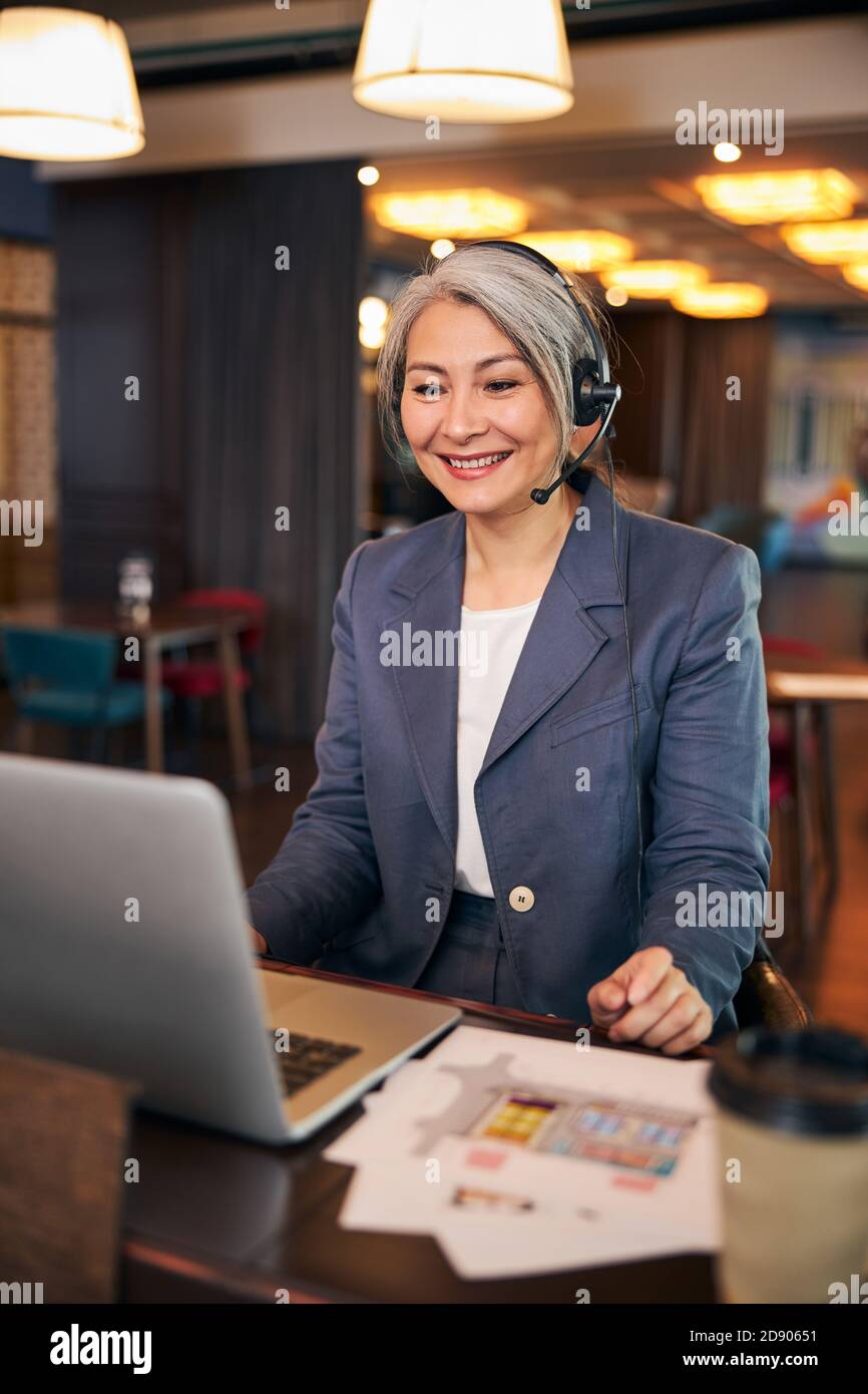 Vertical video cheerful asian worker hi-res stock photography and ...
