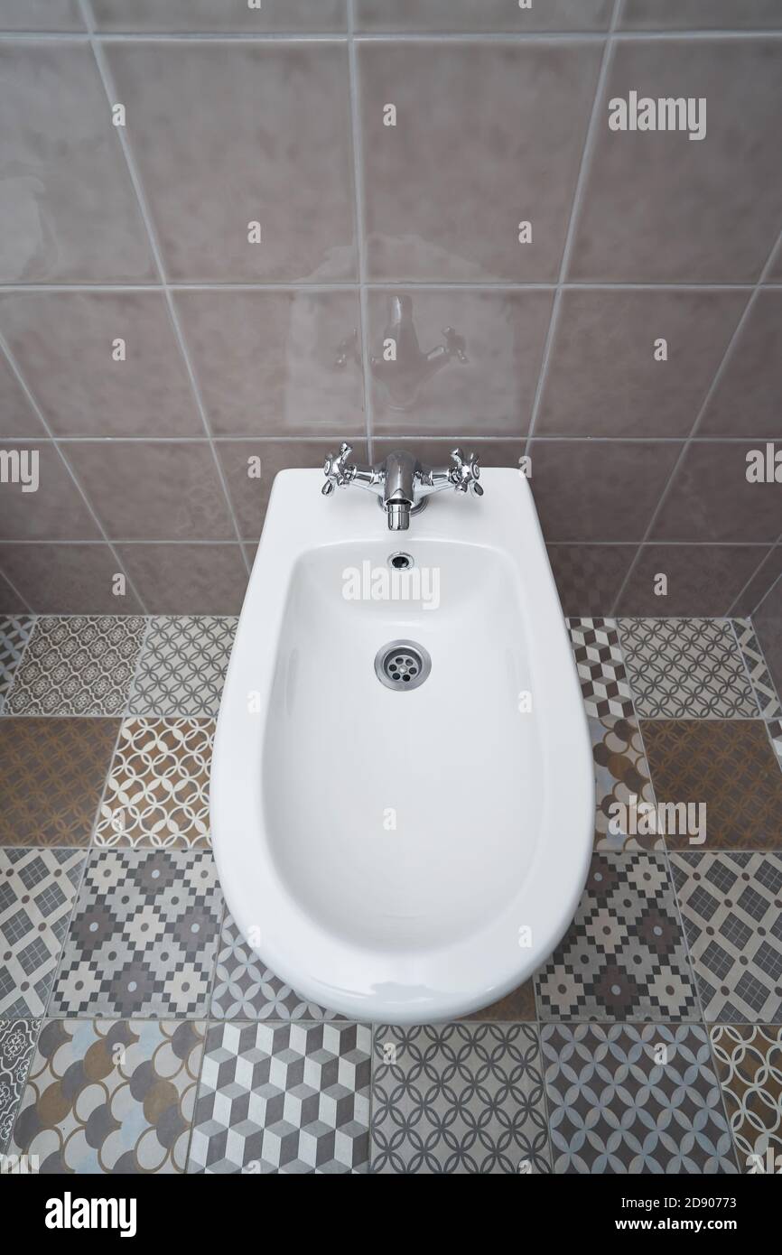 White ceramic bidet with mixer top view Stock Photo - Alamy