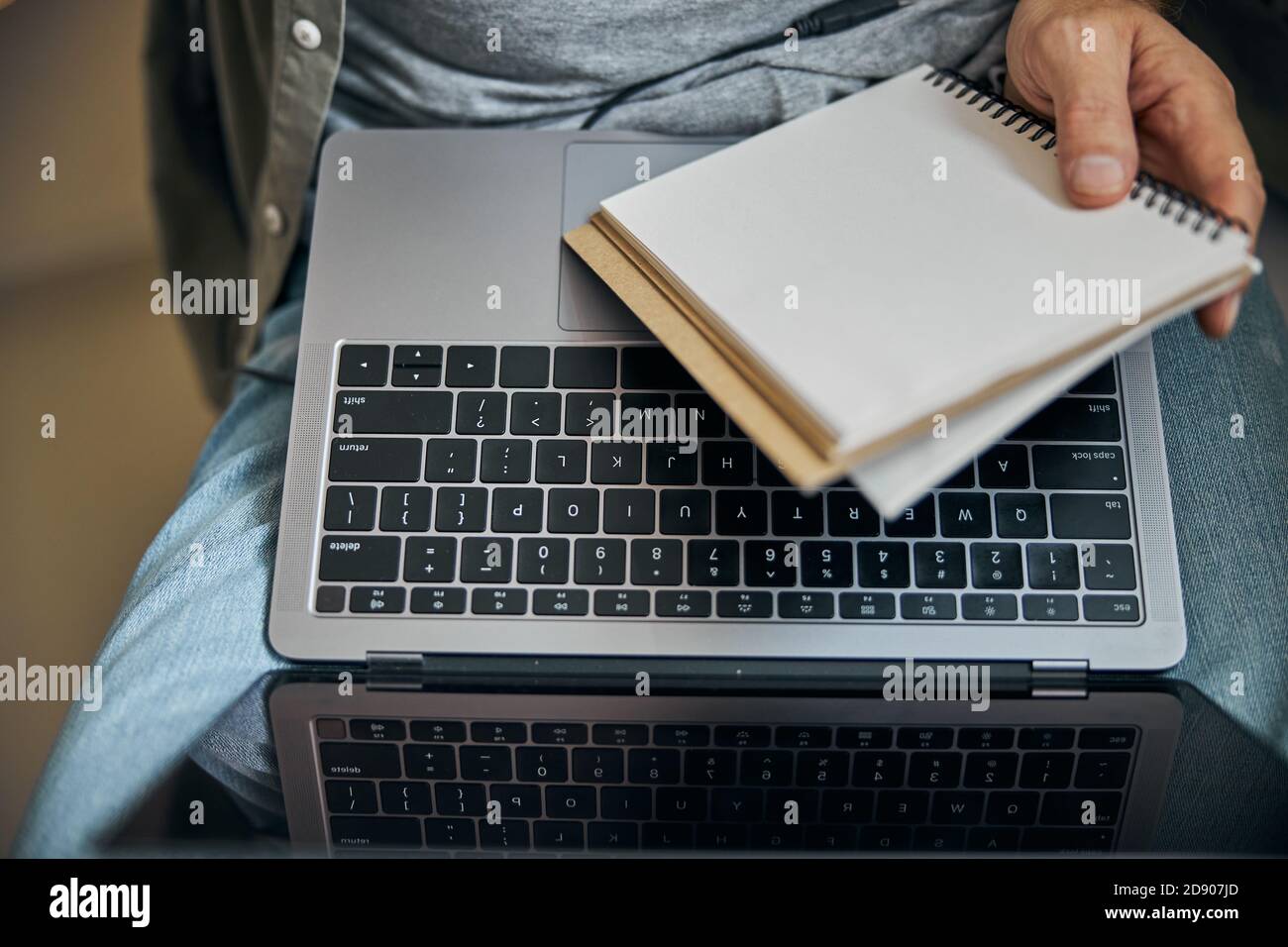 Working man with a notepad and a portable computer Stock Photo - Alamy