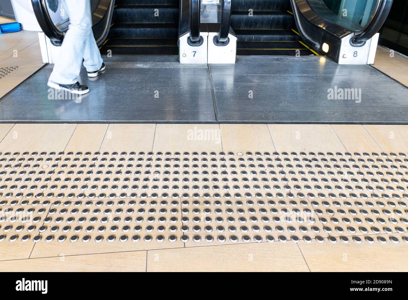Metal floor tactile to guide vision impaired person at mall Stock Photo ...