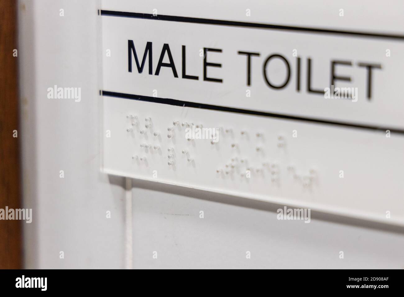 Disablility friendly toilet with braille tactile on signage Stock Photo ...