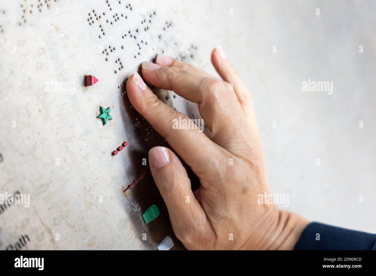 Finger reading braille tactile on public park message board Stock Photo ...