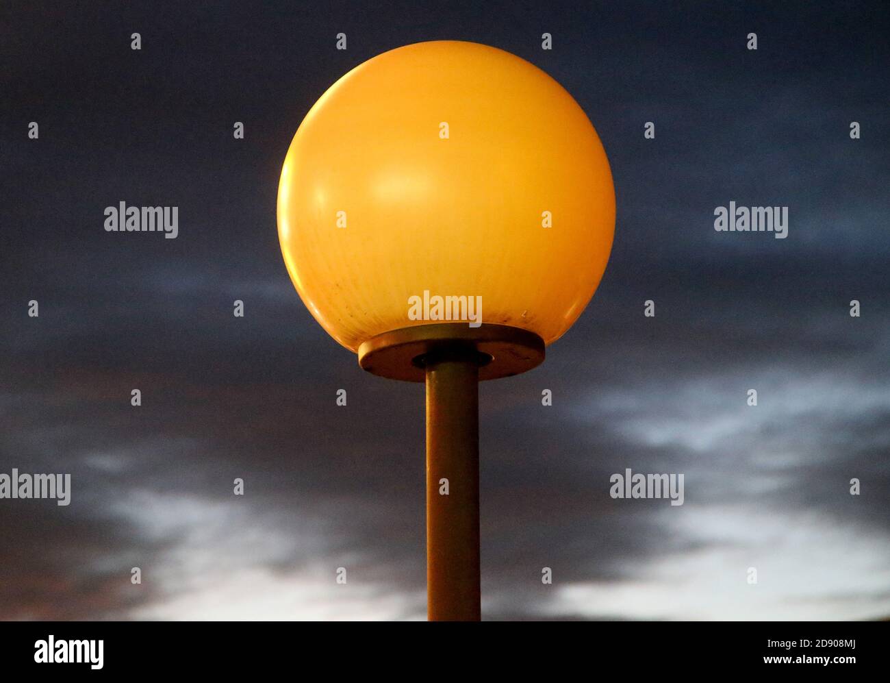 Electric light bulb and sun at beach sunset sky, Milan Italy Stock ...