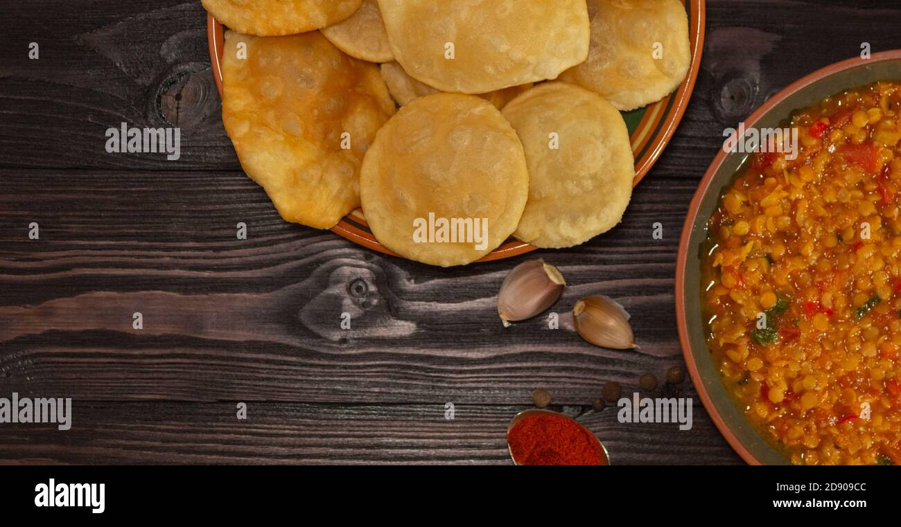 Indian cuisine. Luchi tortillas with cooked vegetables Stock Photo - Alamy