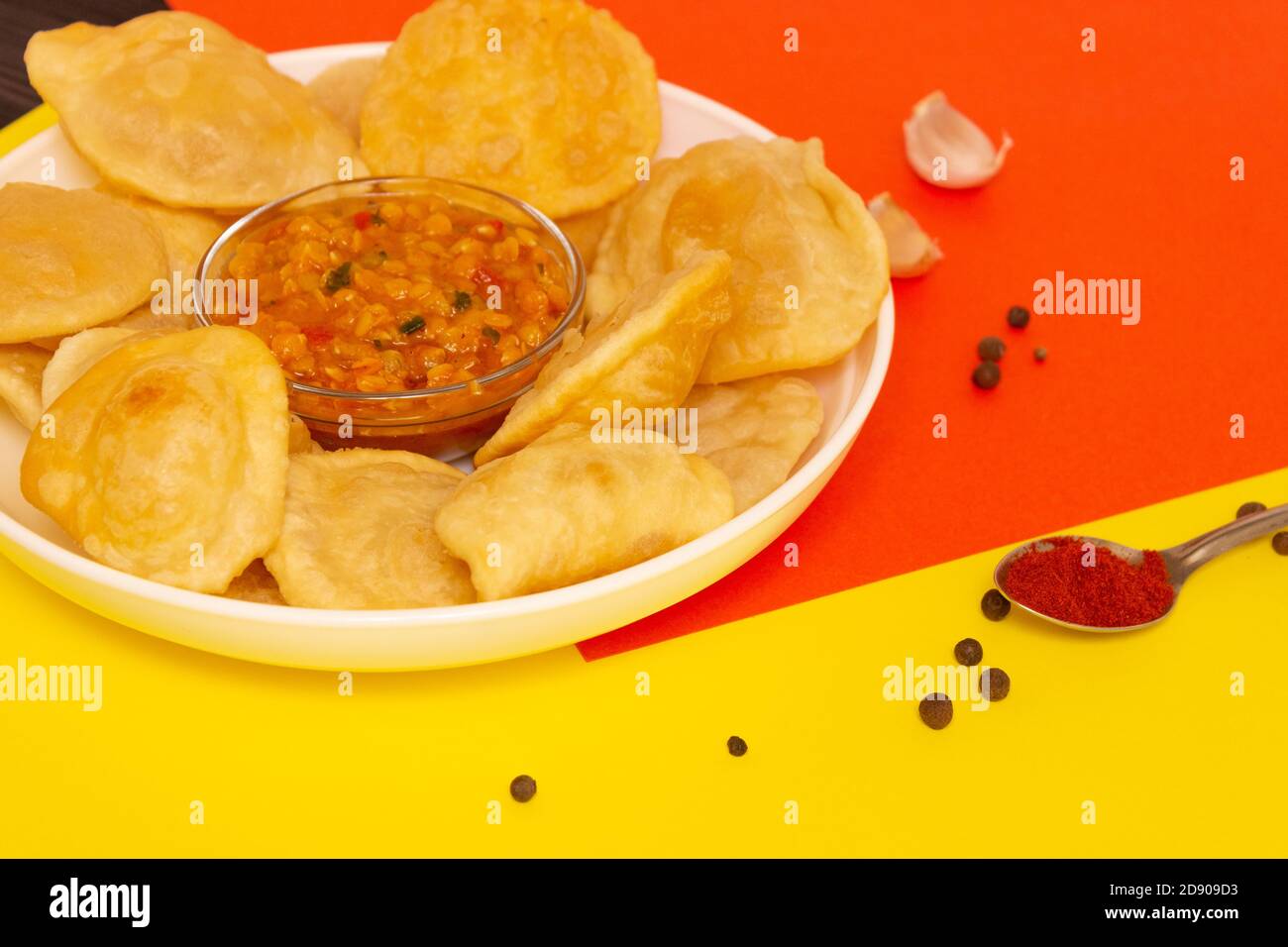 Indian cuisine. Luchi tortillas with cooked and fresh vegetables Stock ...