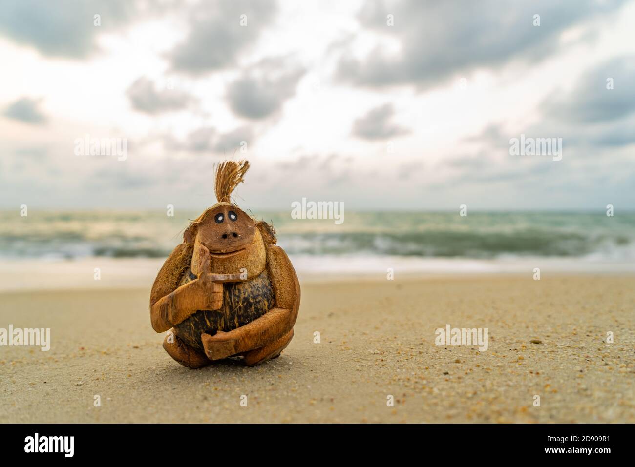 Monkey coconut sculpture at the beach in Thailand Stock Photo - Alamy