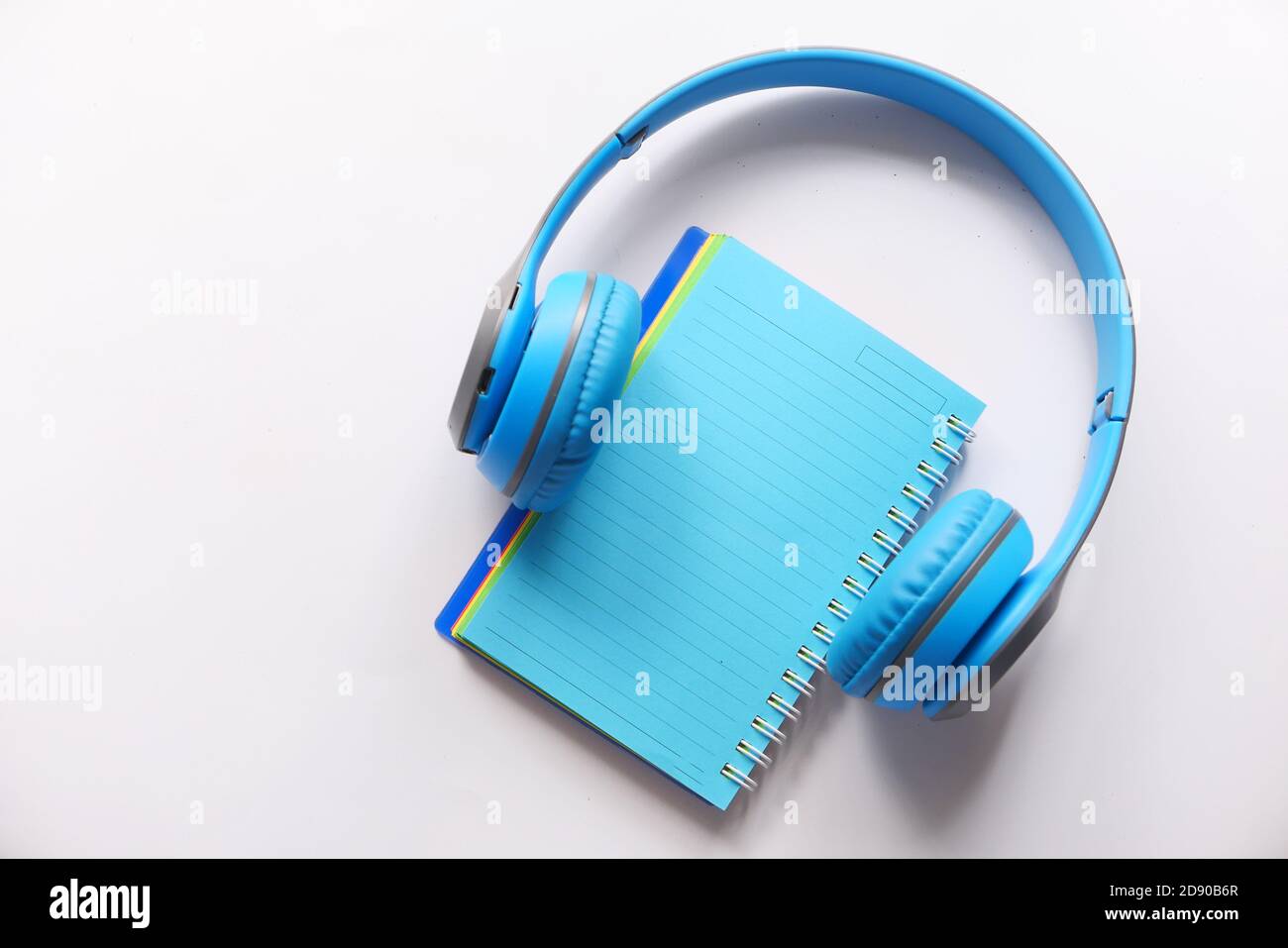 Audio book concept. Headphones and notepad on white background Stock ...