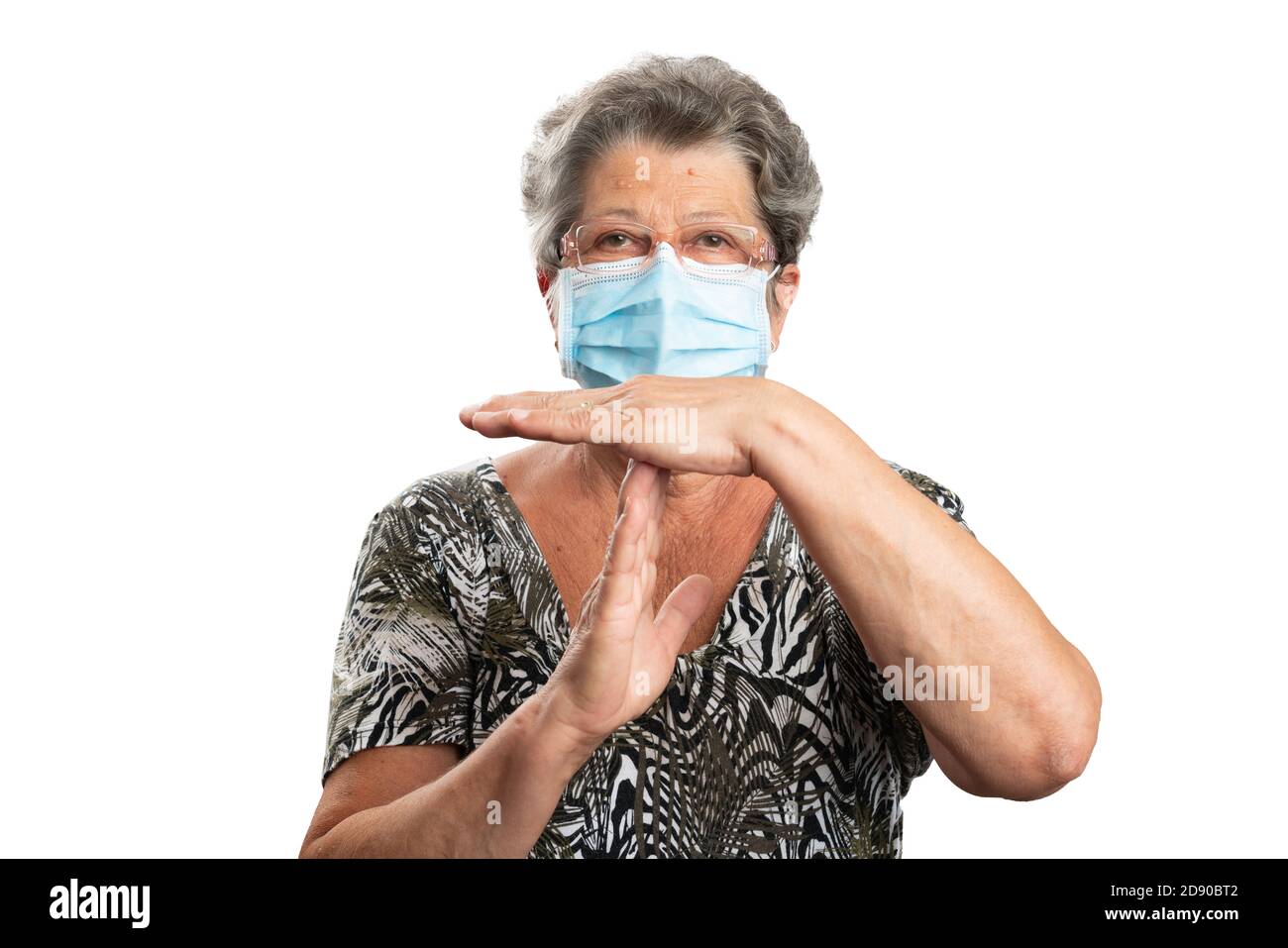 Elderly female person with glasses making timeout pause gesture wearing ...