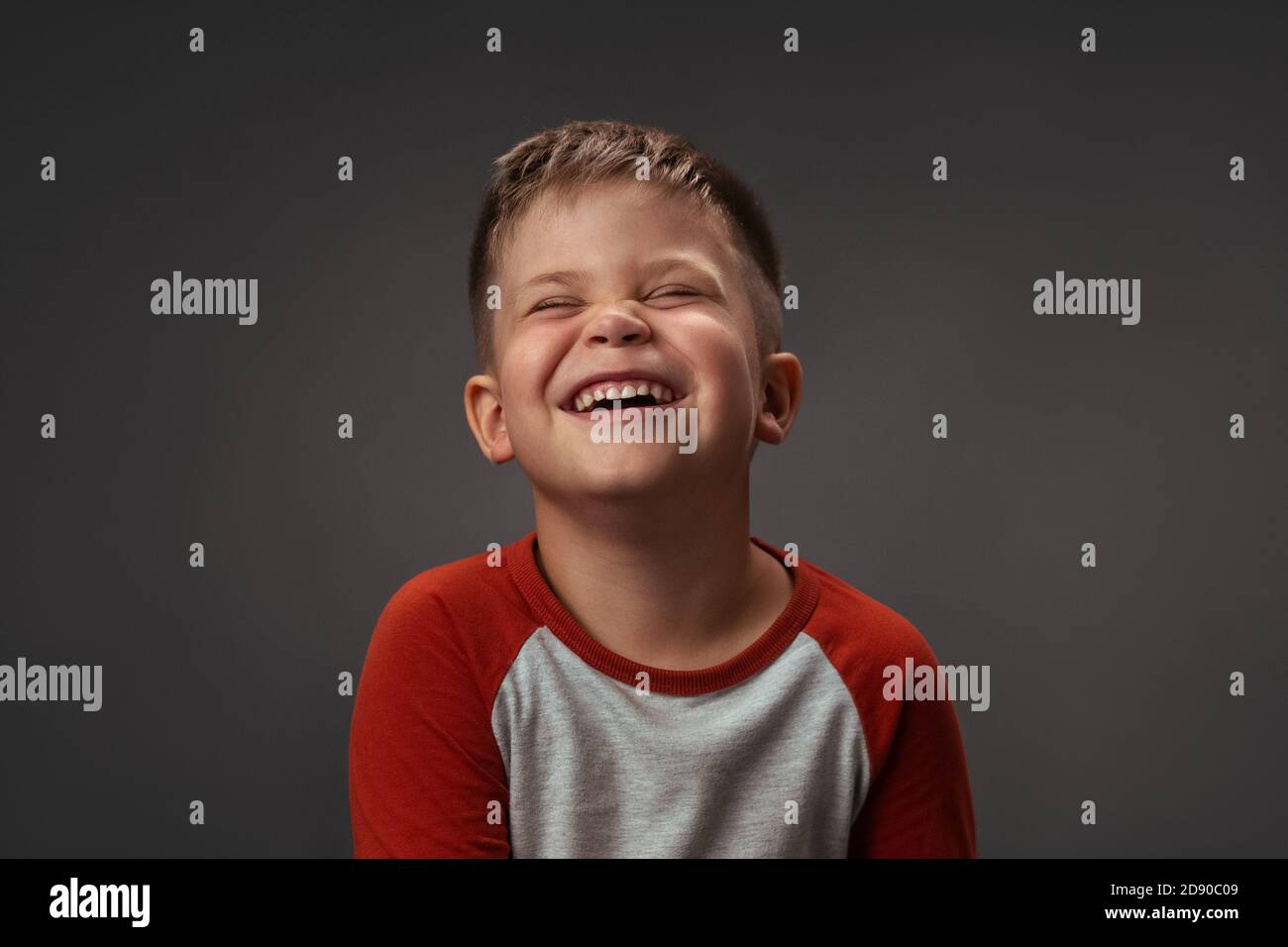 Portrait of a child. Funny little caucasian boy laughing in studio ...